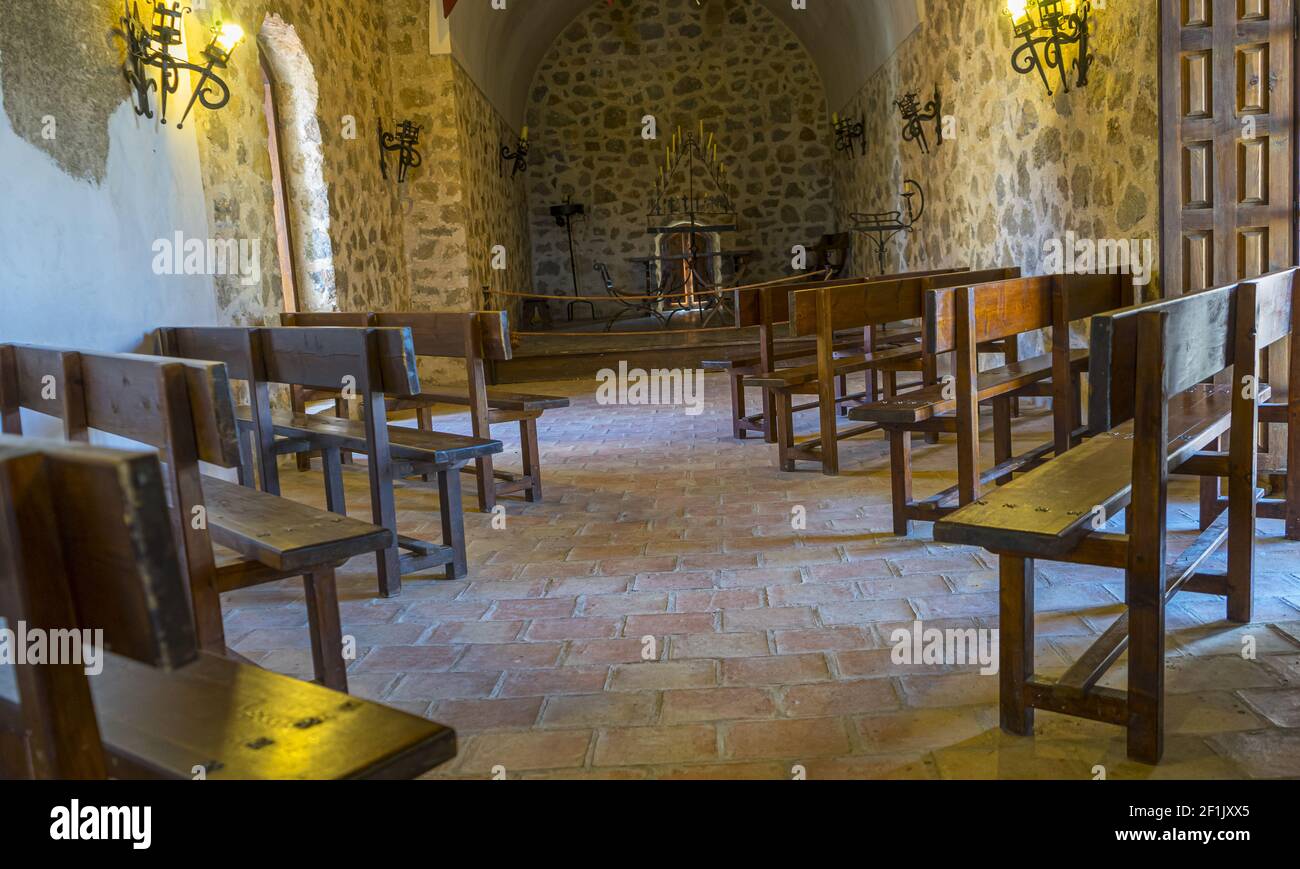 Interior of a medieval castle in Toledo, Spain. Stone rooms with wooden ...