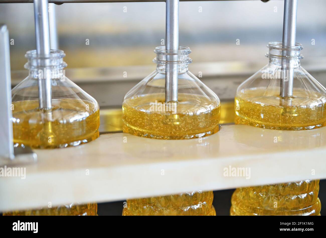 Sunflower oil. Factory line of production and filling of refined oil ...
