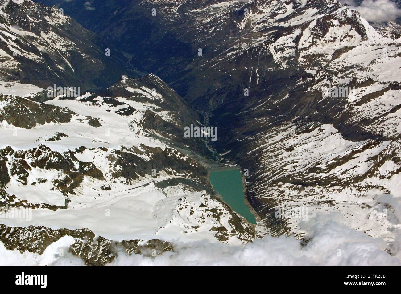 Aerial view of a dammed lake in the Pennine Alp region, just east of ...