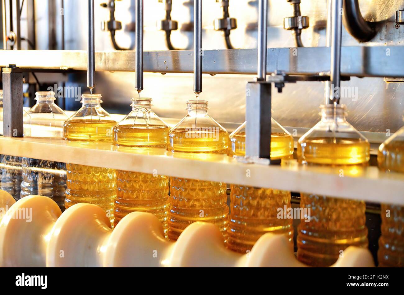Sunflower oil. Factory line of production and filling of refined oil ...