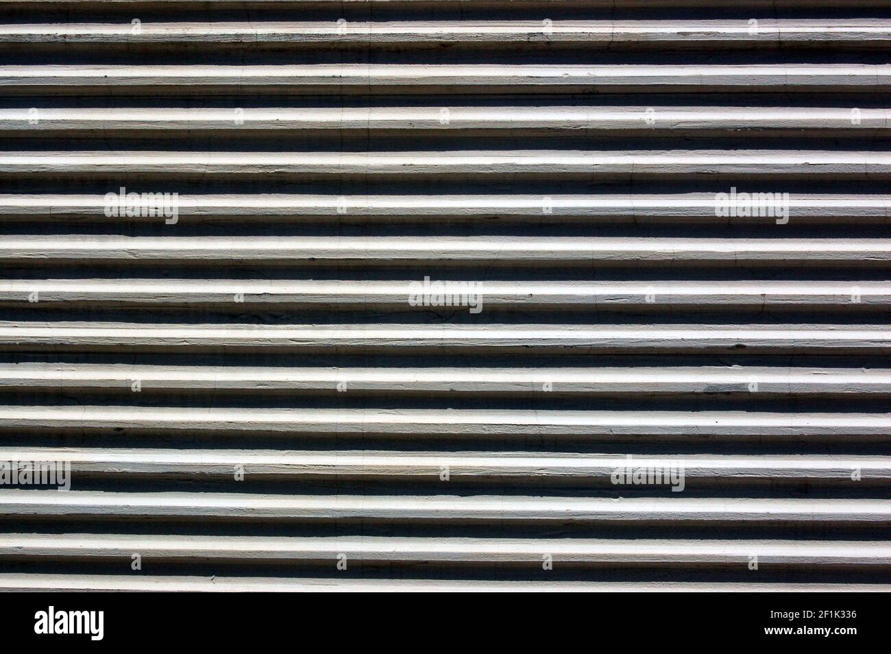 Abstract detail of a concrete wall covered with distinctive horizontal ...