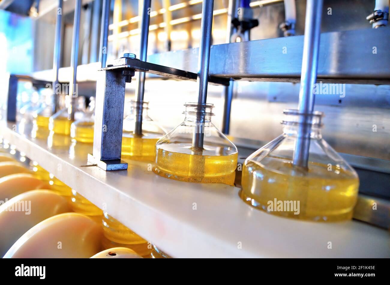 Sunflower oil. Factory line of production and filling of refined oil ...