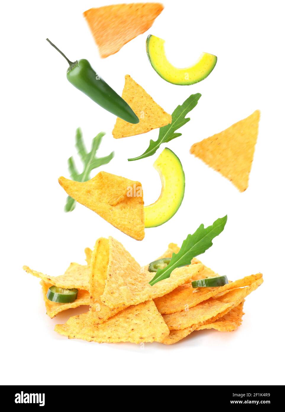 Flying nachos with ingredients on white background Stock Photo - Alamy