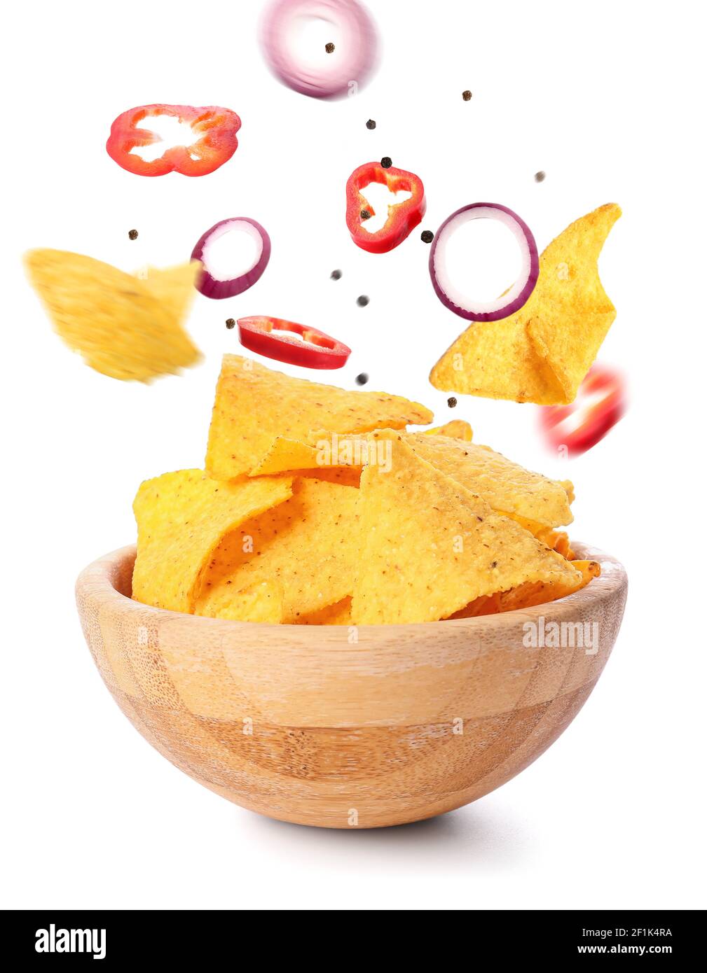 Flying nachos with ingredients and bowl on white background Stock Photo ...