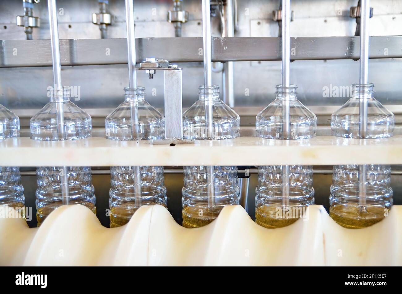 Sunflower oil. Factory line of production and filling of refined oil ...