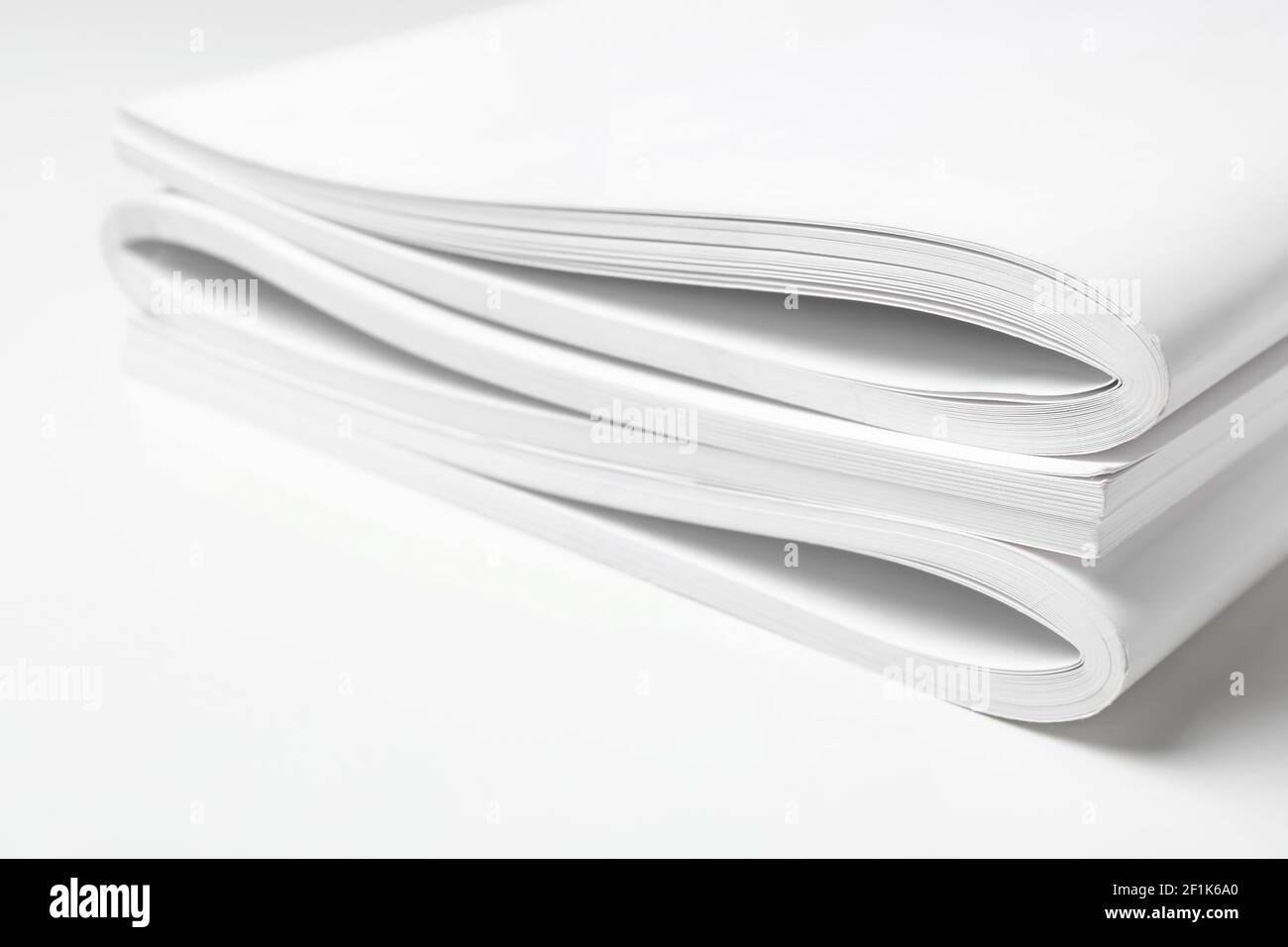 Stack of blank magazines on white background Stock Photo - Alamy