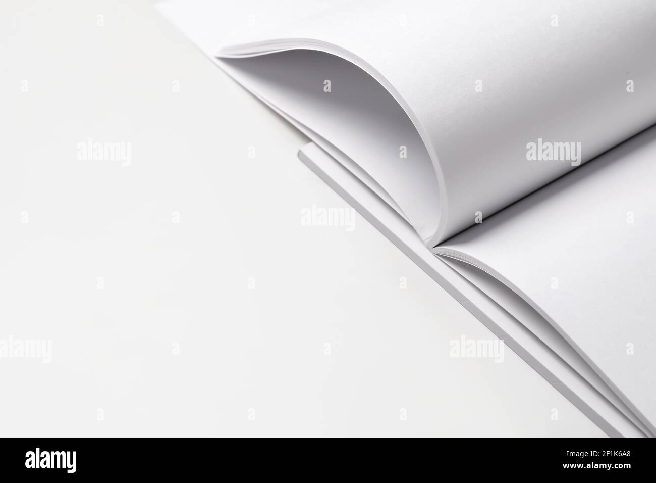 Open blank magazine on white background Stock Photo - Alamy