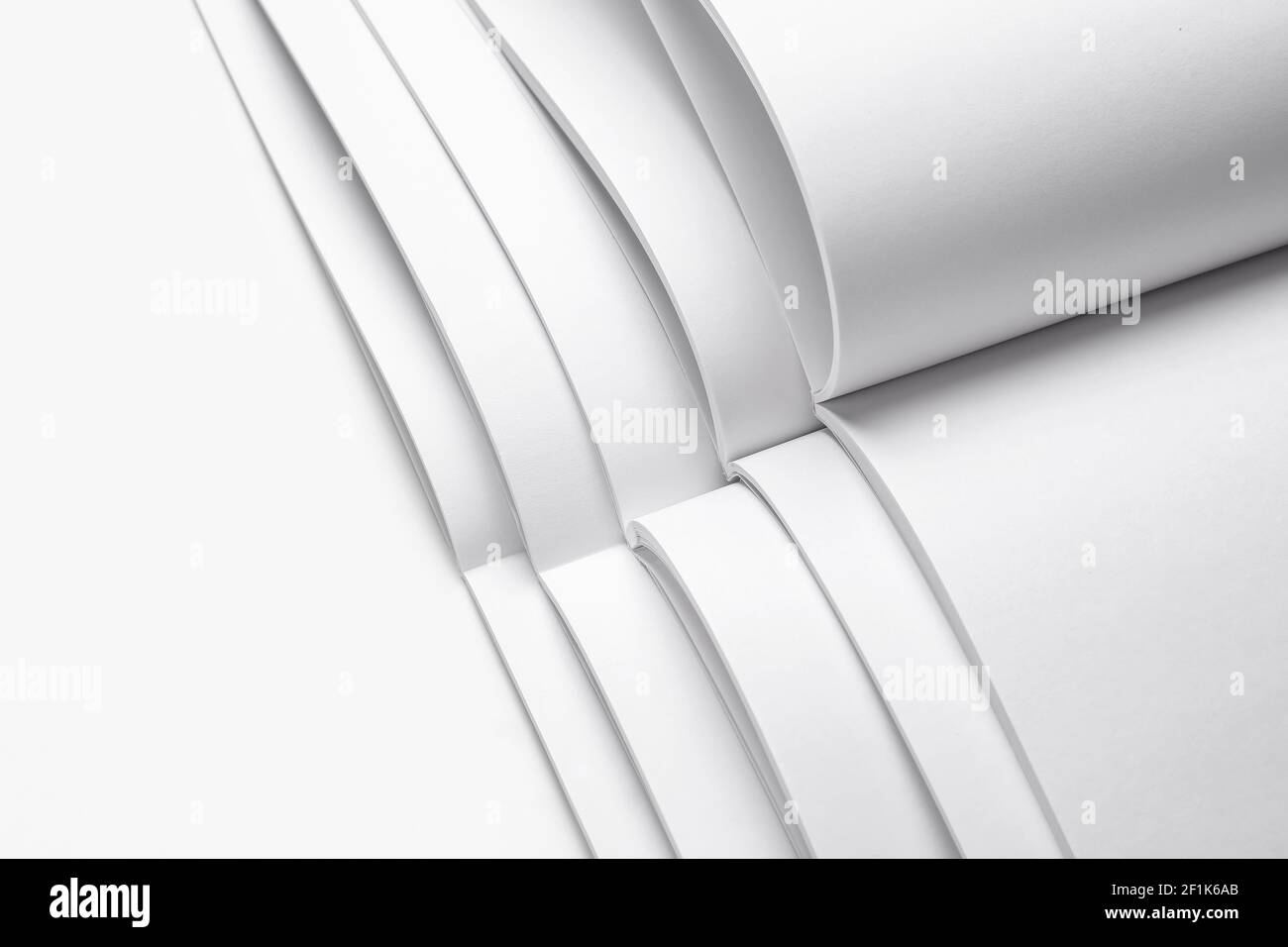 Open blank magazines on white background Stock Photo - Alamy