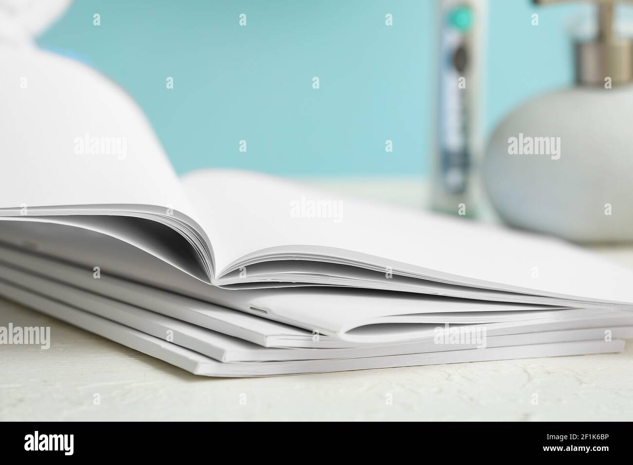 Open blank magazines on table Stock Photo - Alamy