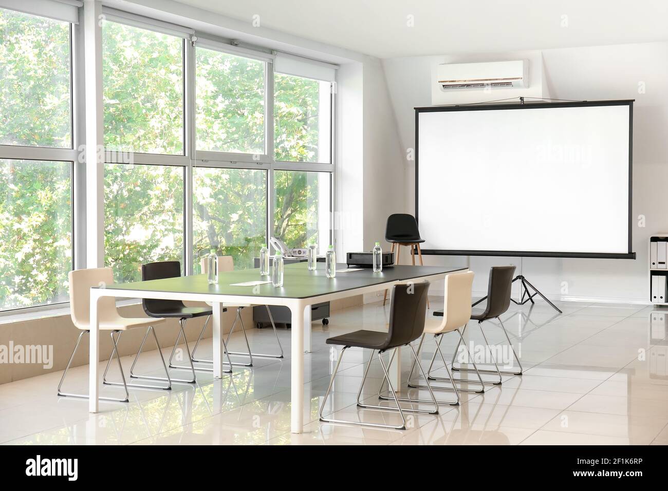 Room with projector prepared for conference in office Stock Photo - Alamy