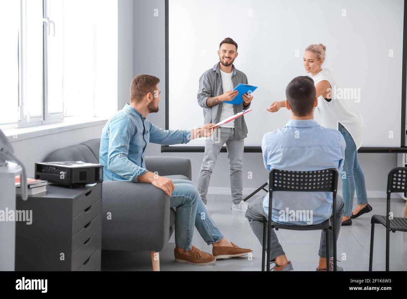 Business people giving presentation during meeting in office Stock ...