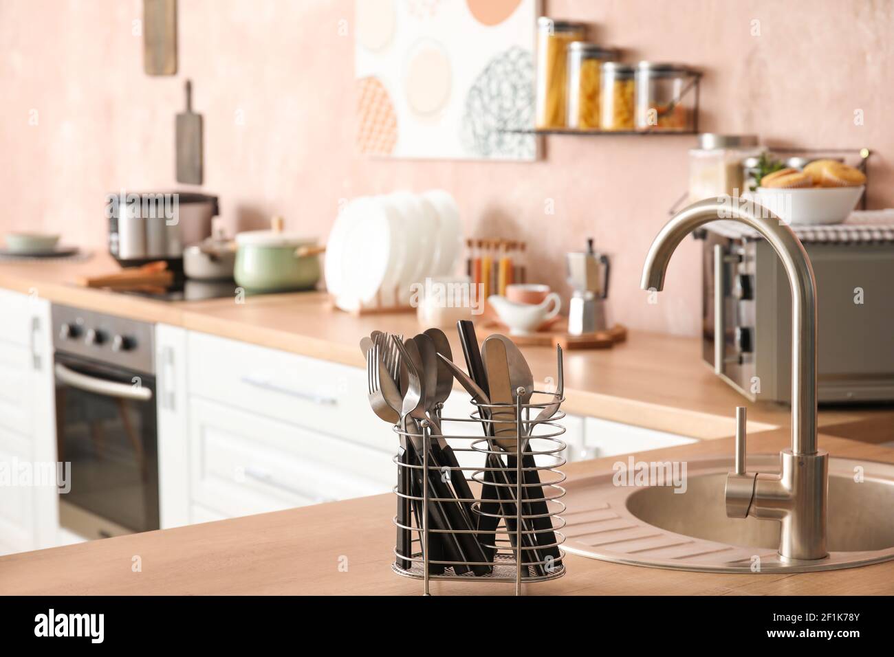 Different utensils on kitchen counter Stock Photo - Alamy