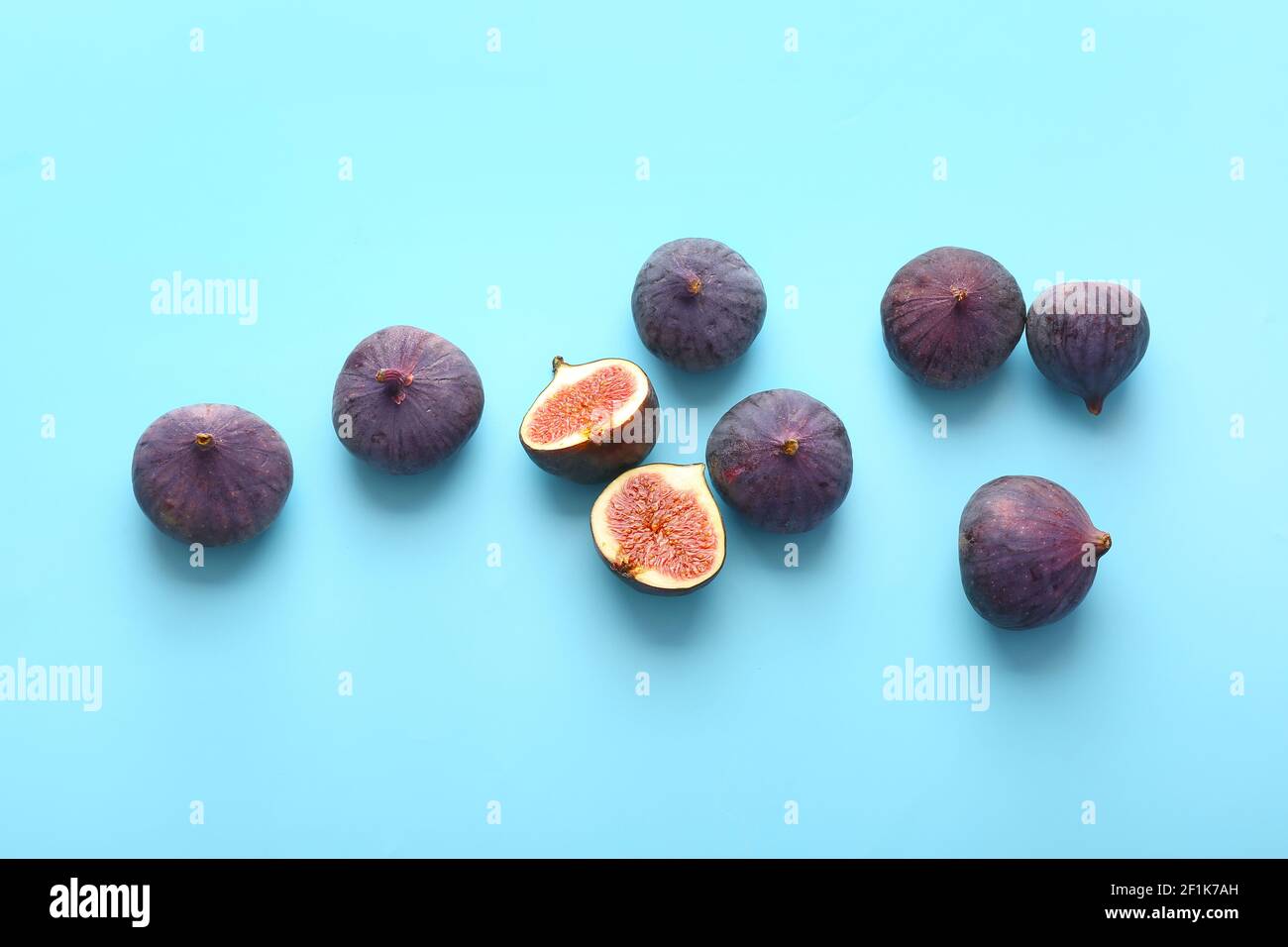 Composition with fresh figs on color background Stock Photo - Alamy