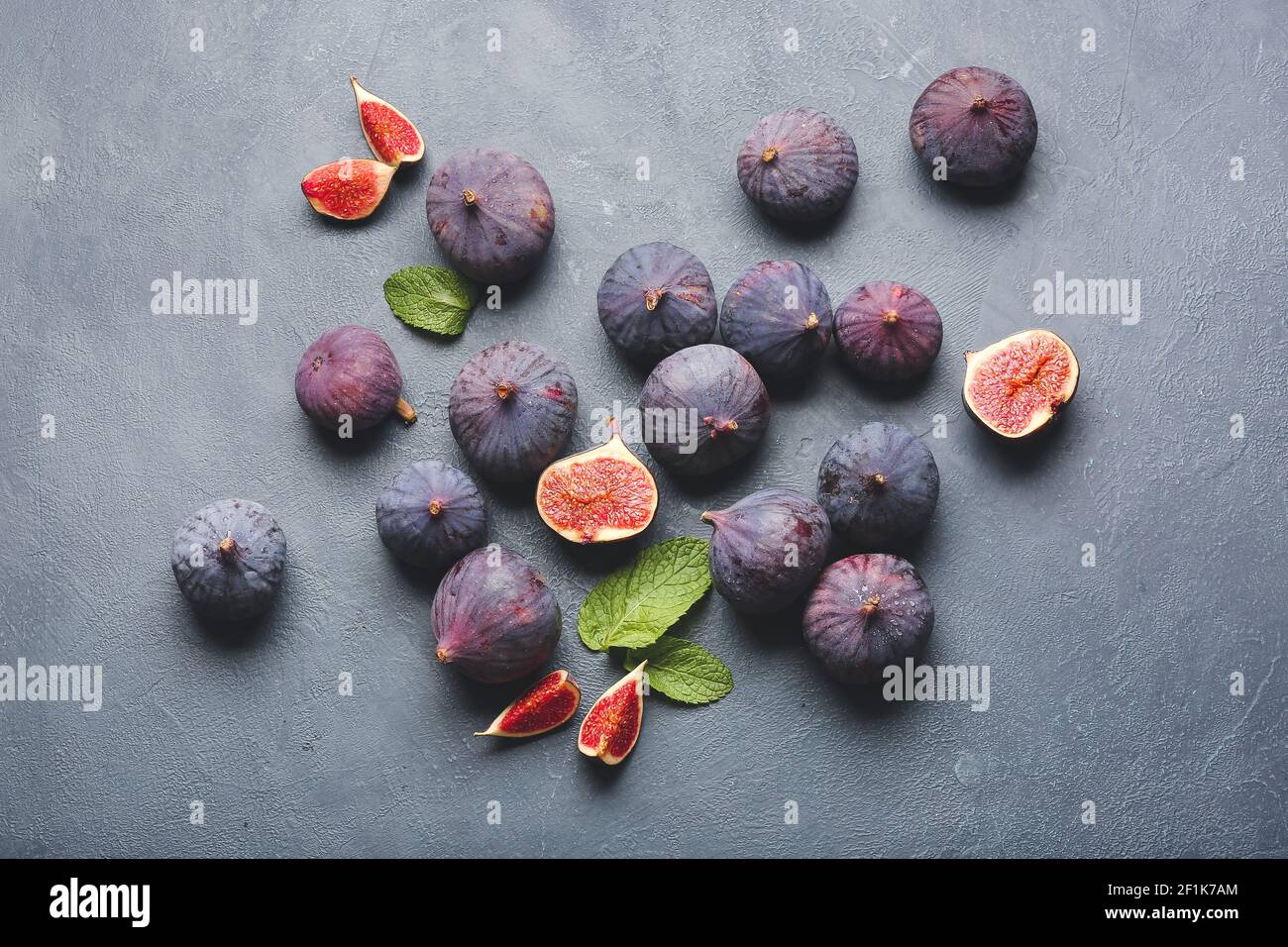 Composition with fresh figs on dark background Stock Photo - Alamy
