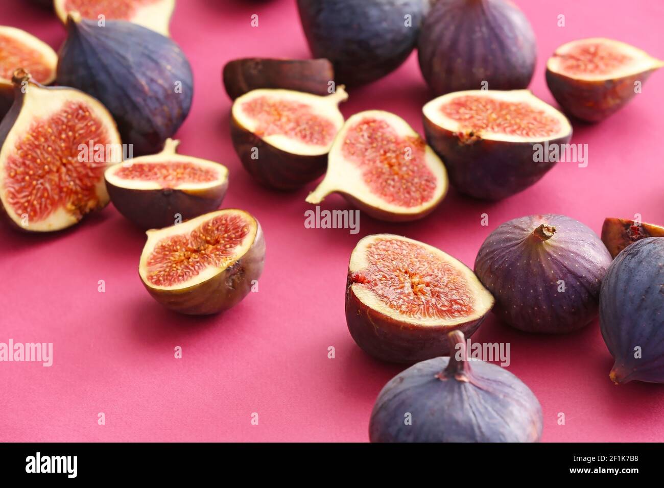 Composition with fresh figs on color background Stock Photo - Alamy