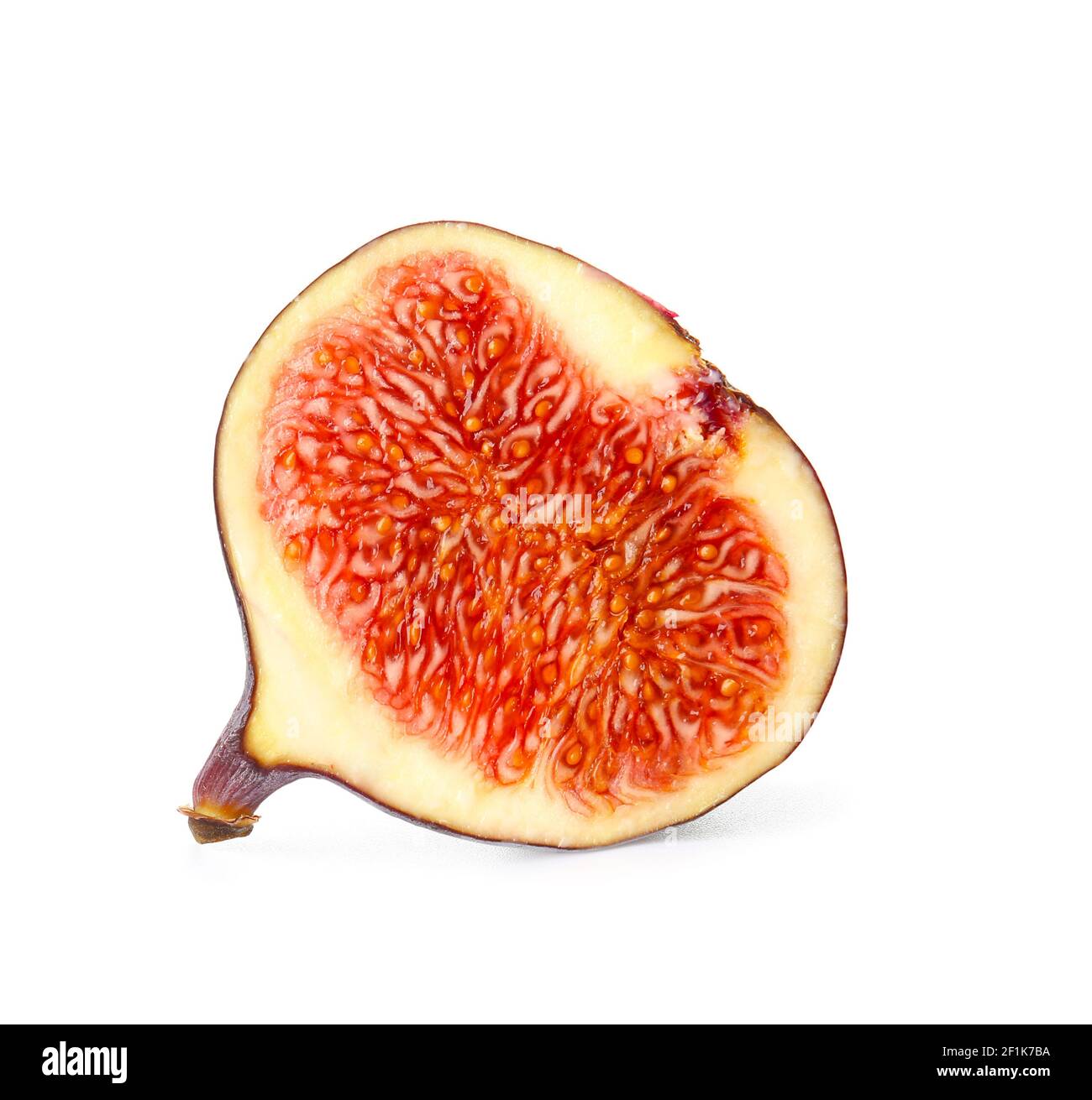 Fresh cut fig on white background Stock Photo - Alamy