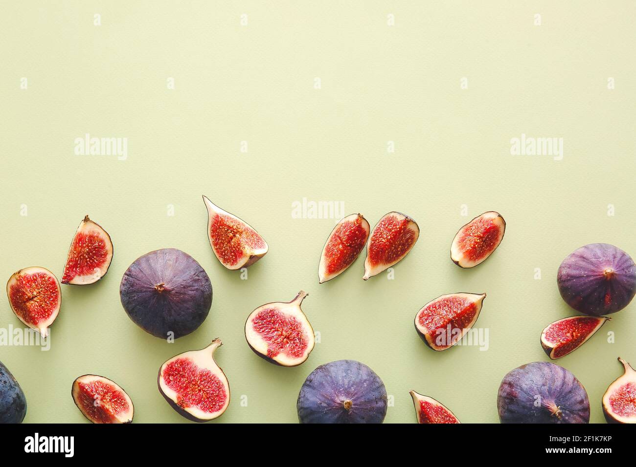 Composition with fresh figs on color background Stock Photo - Alamy