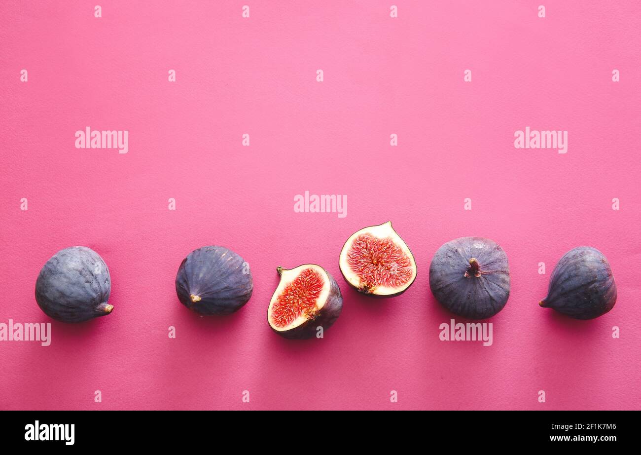 Composition with fresh figs on color background Stock Photo - Alamy