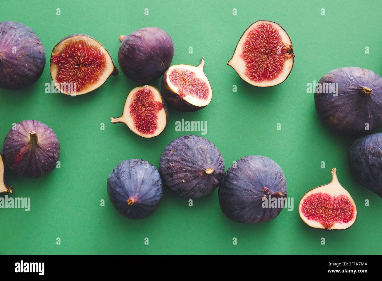 Composition with fresh figs on color background Stock Photo - Alamy