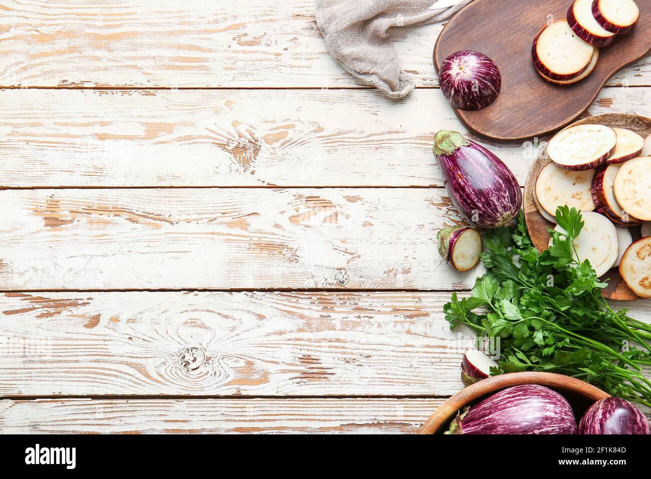 Composition with fresh eggplants on wooden background Stock Photo - Alamy