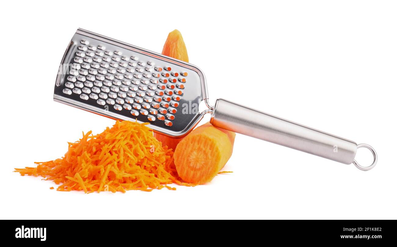 Metal grater and carrot on white background Stock Photo - Alamy