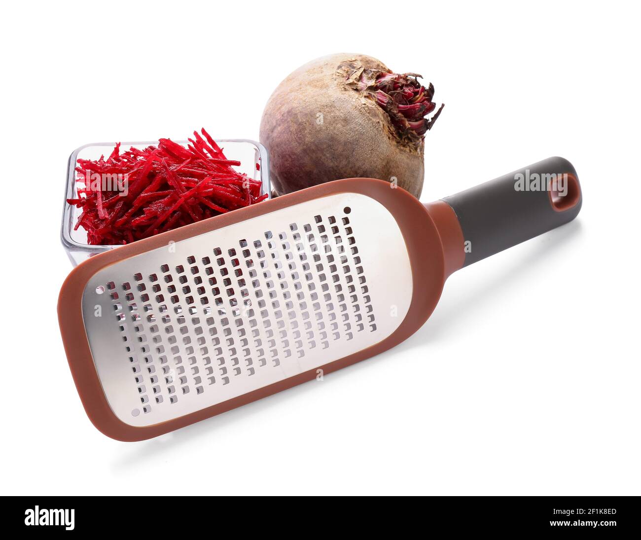 Metal grater and fresh beetroot on white background Stock Photo - Alamy