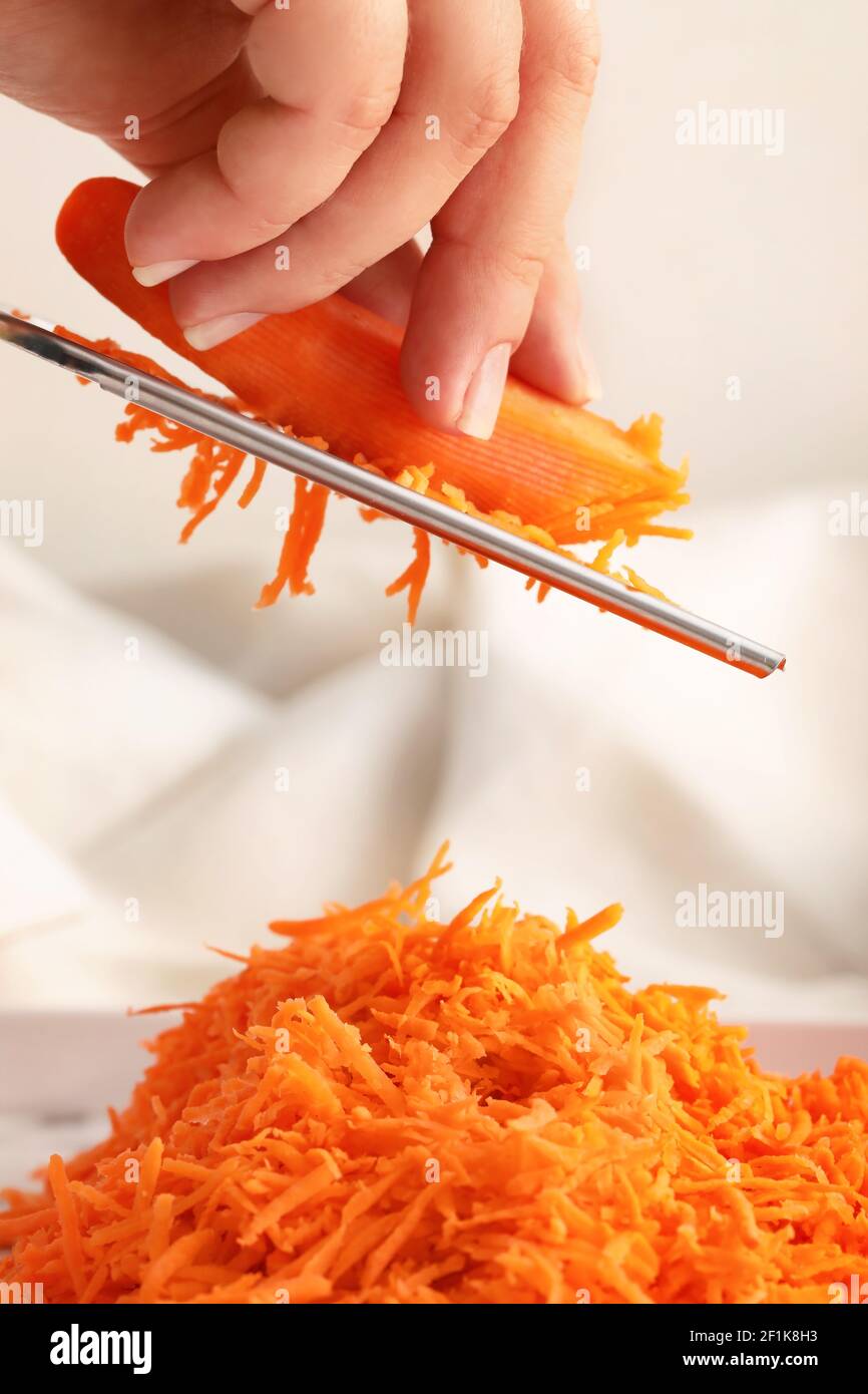 Hand grating carrot hi-res stock photography and images - Alamy