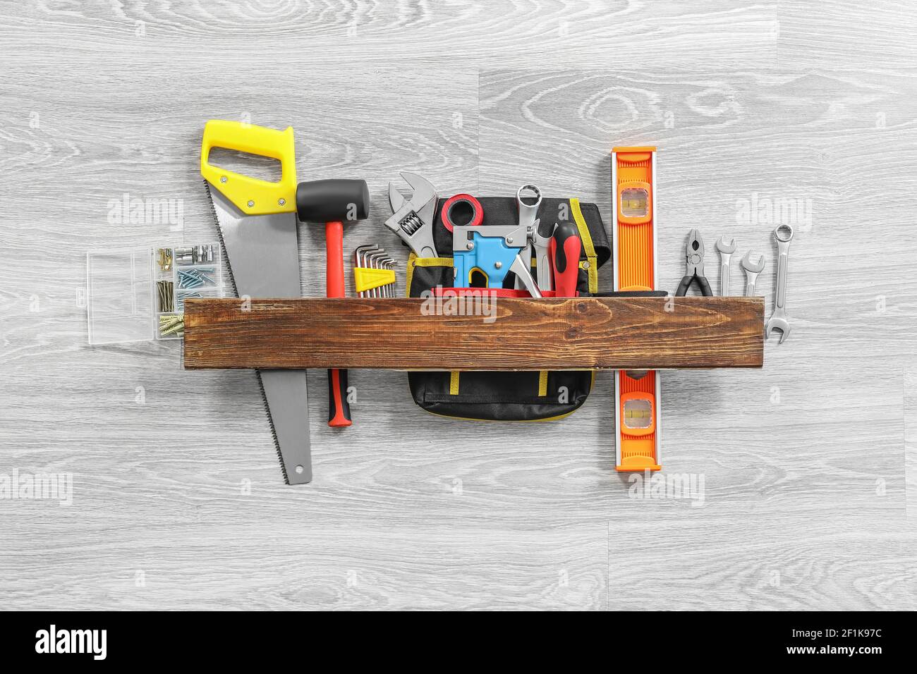 Set of construction tools on grey wooden background Stock Photo - Alamy