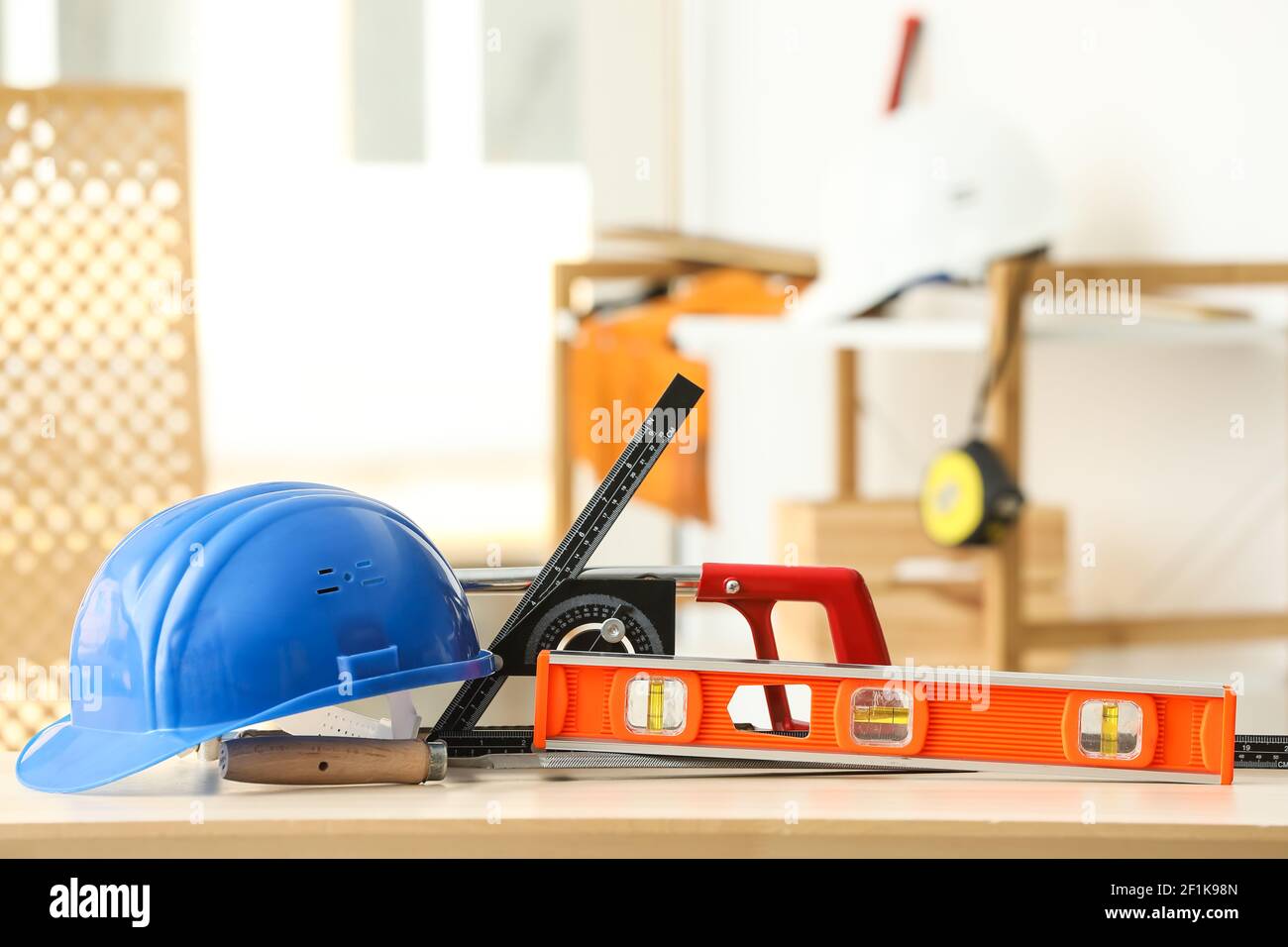 Set of construction tools on table in workshop Stock Photo - Alamy