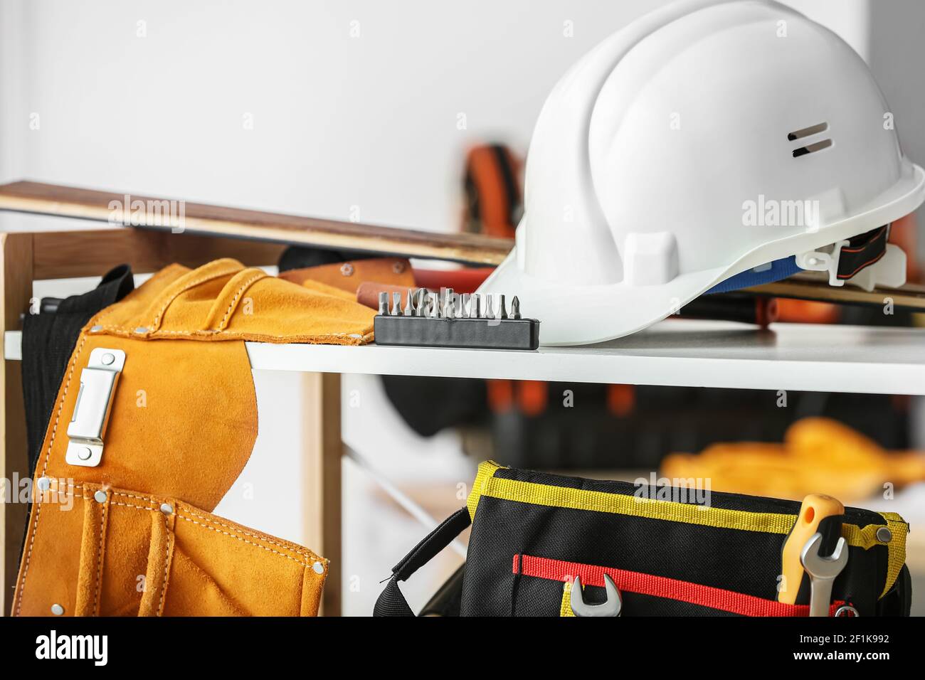 Different construction tools on rack in workshop, closeup Stock Photo ...