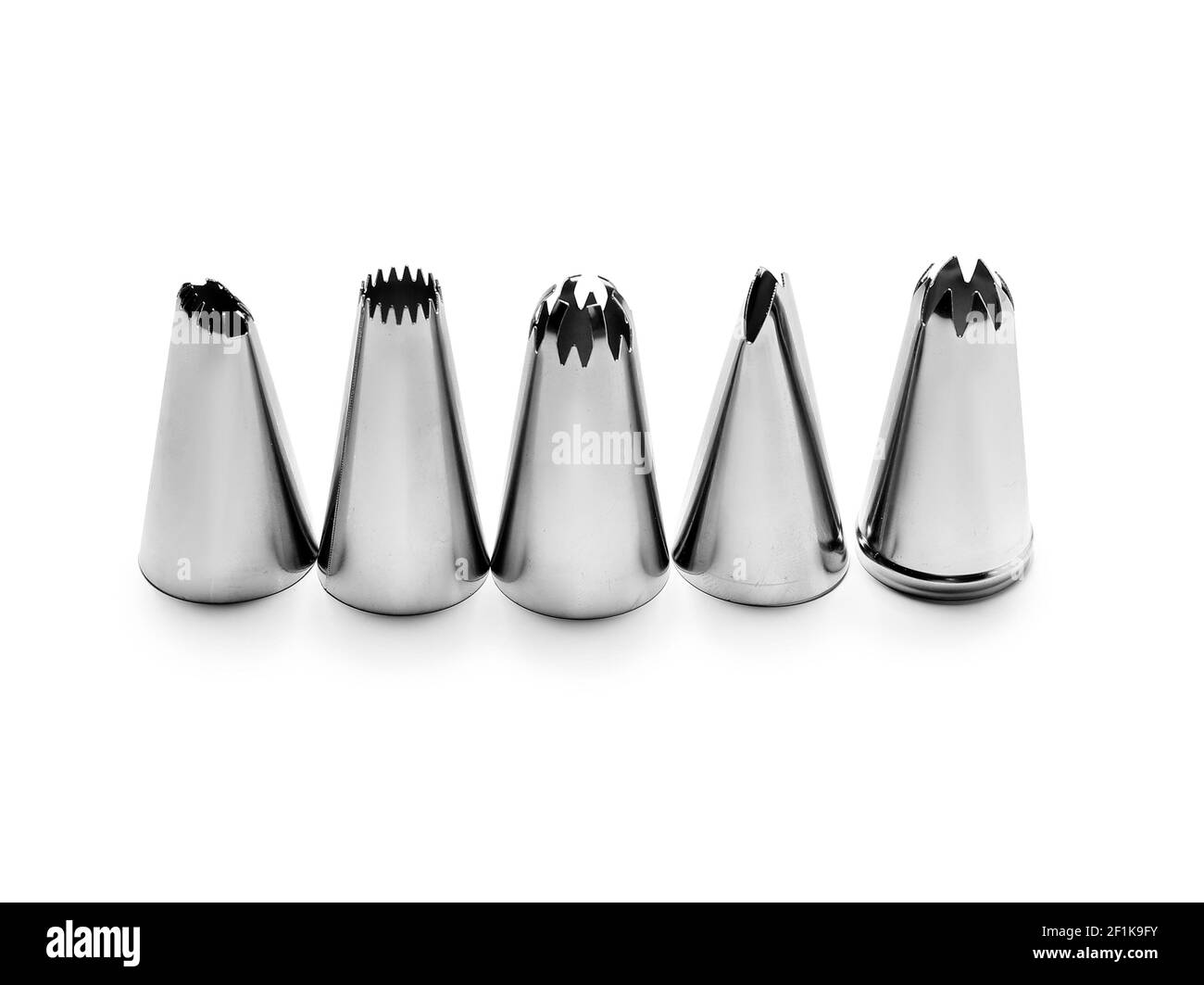 Different piping tips on white background Stock Photo - Alamy