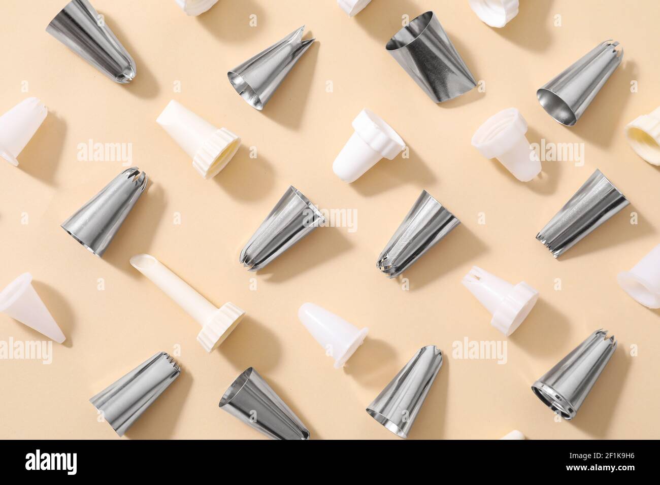 Different piping tips on color background, closeup Stock Photo - Alamy
