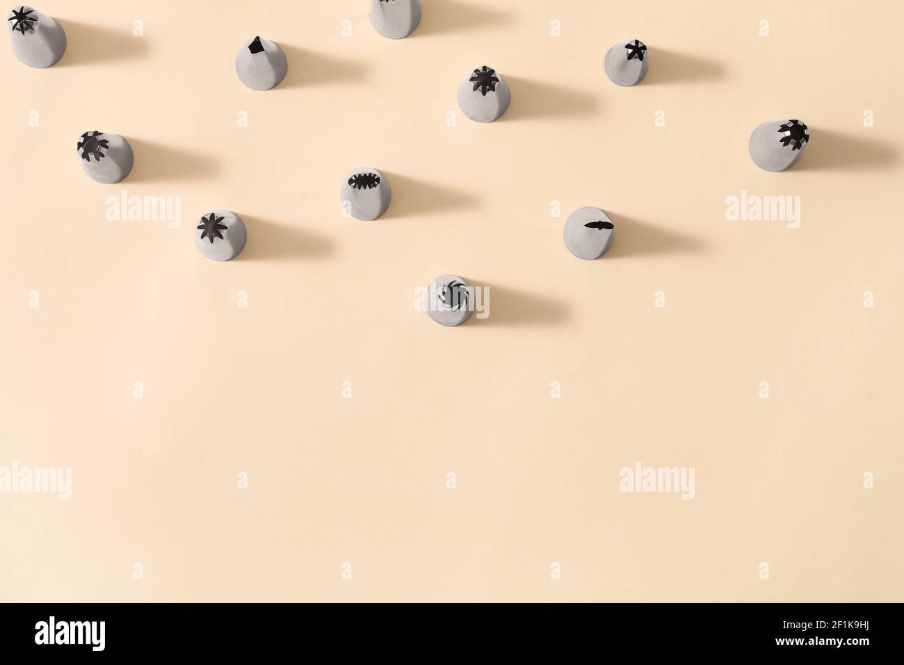 Different piping tips on color background Stock Photo - Alamy