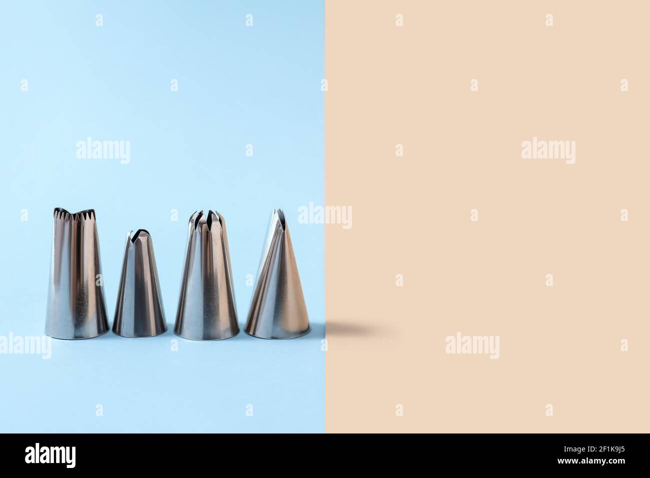 Different piping tips on color background, closeup Stock Photo - Alamy