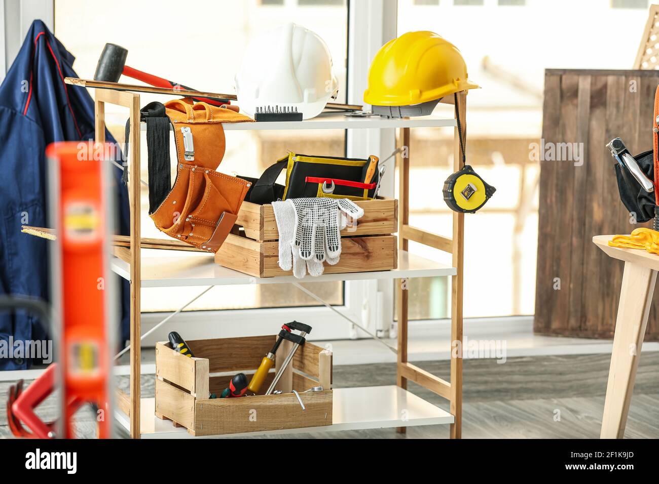 Rack with construction tools in workshop Stock Photo - Alamy