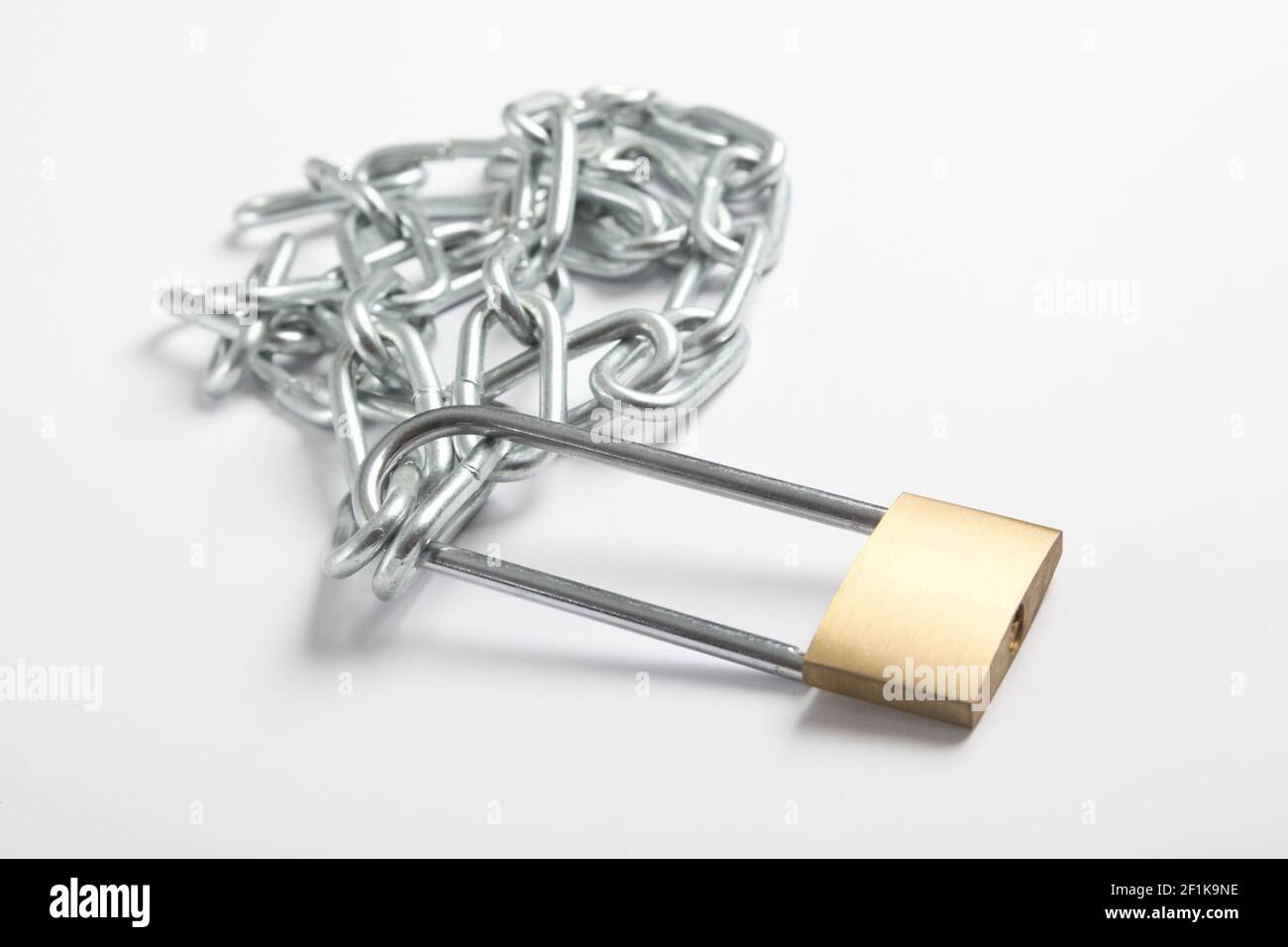 Padlock and chains, on white background Stock Photo - Alamy