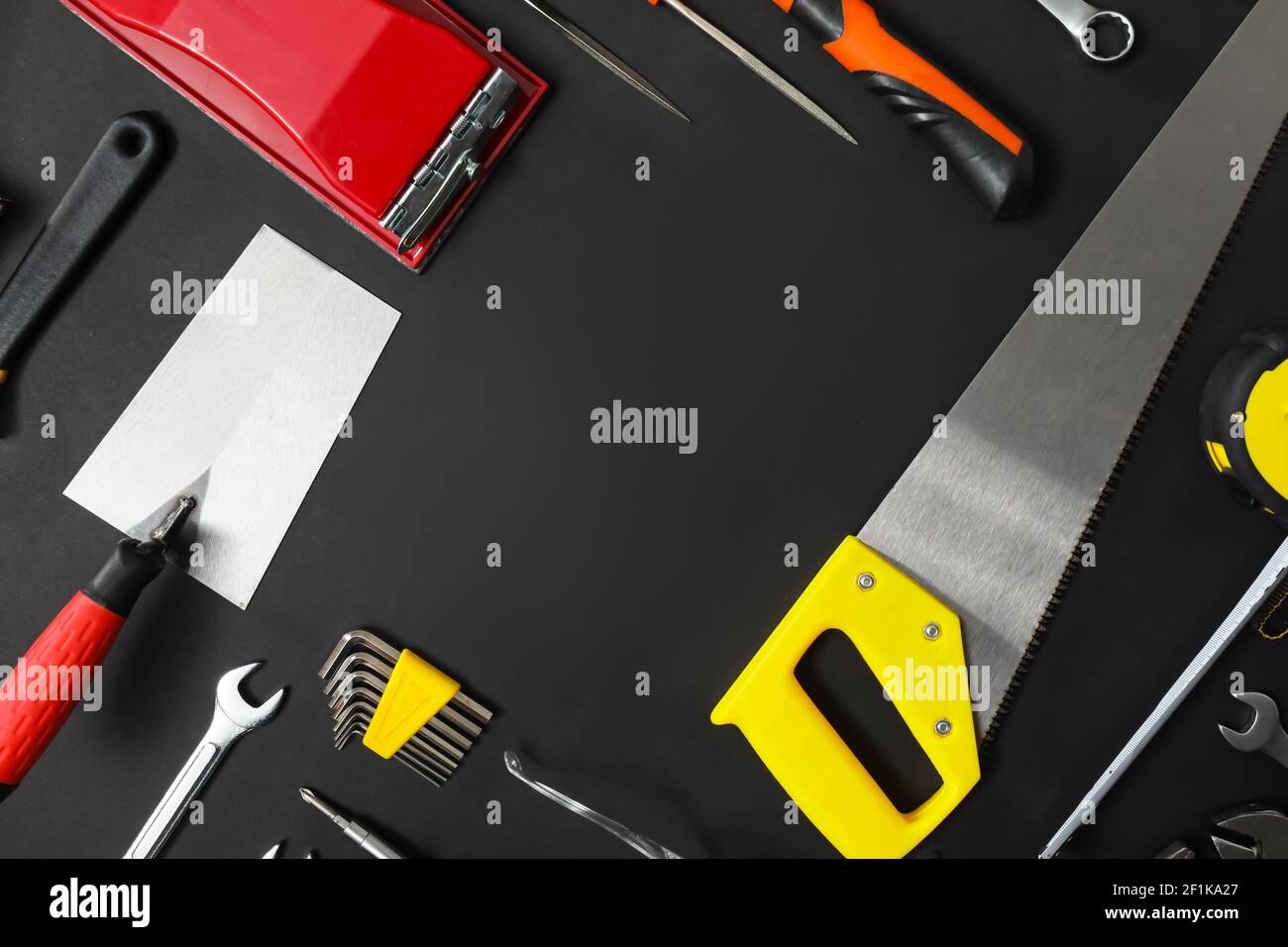 Frame made of construction tools on dark background Stock Photo - Alamy
