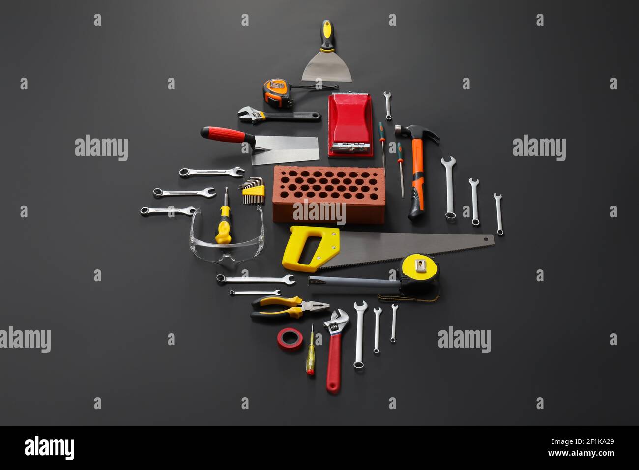 Set of construction tools on dark background Stock Photo - Alamy