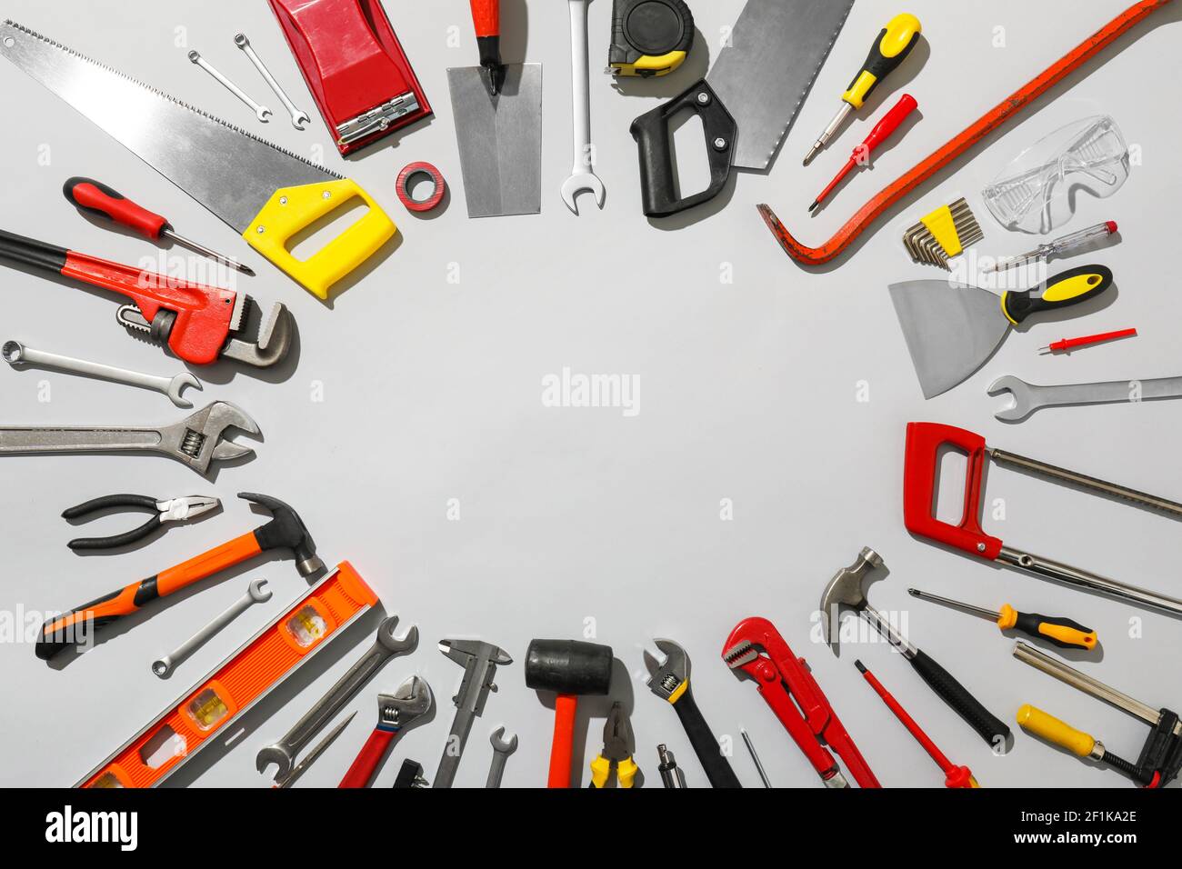 Frame made of construction tools on light background Stock Photo - Alamy