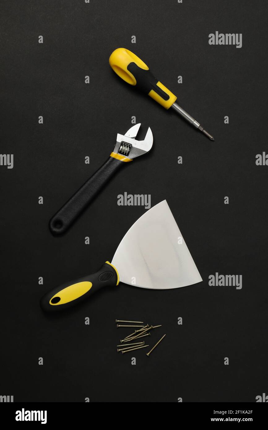 Set of construction tools on dark background Stock Photo - Alamy