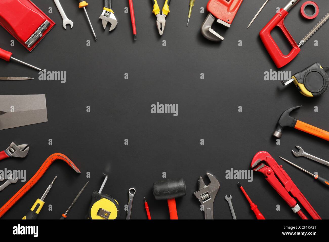 Frame made of construction tools on dark background Stock Photo - Alamy