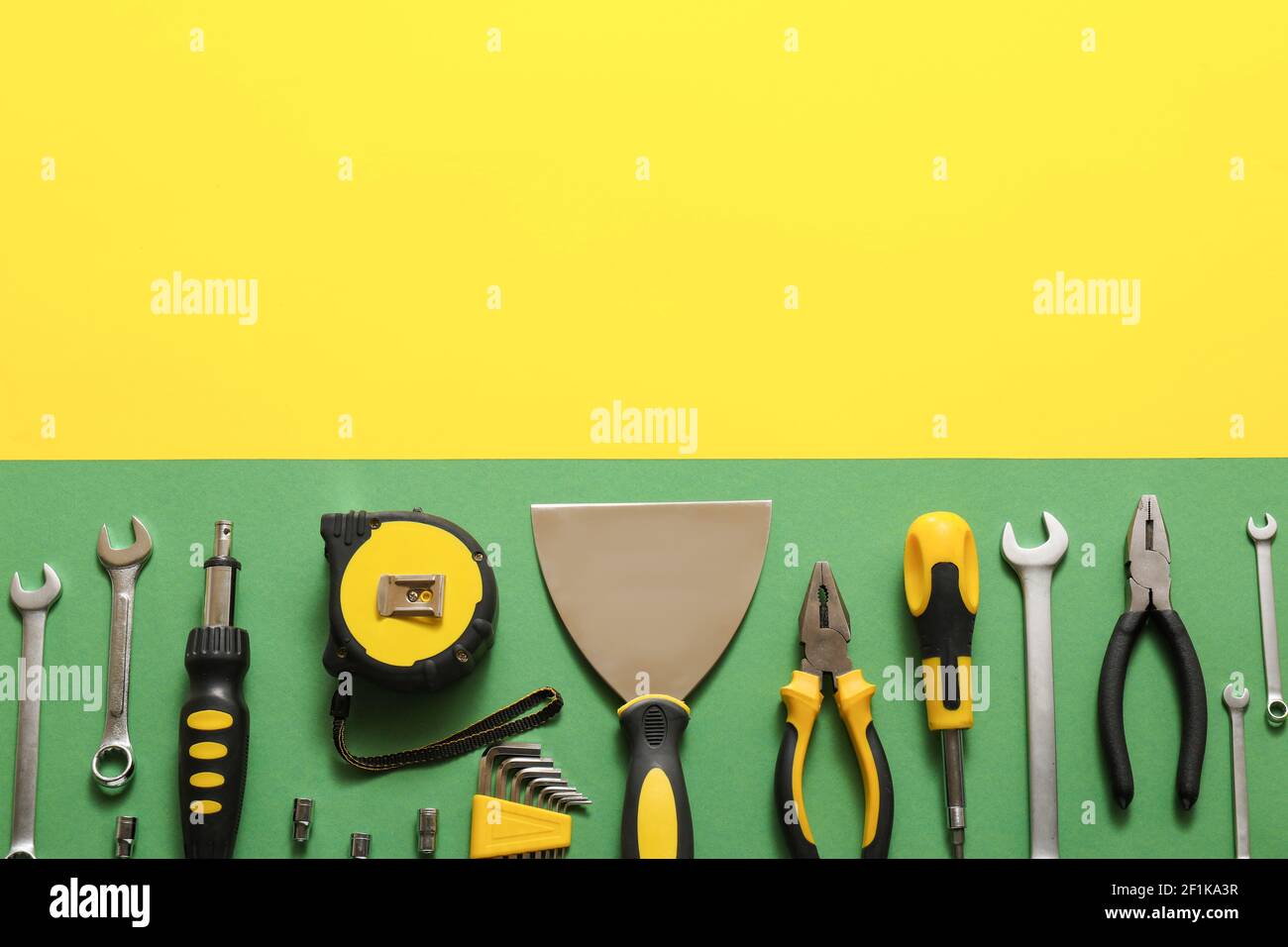 Set of construction tools on colorful background Stock Photo - Alamy