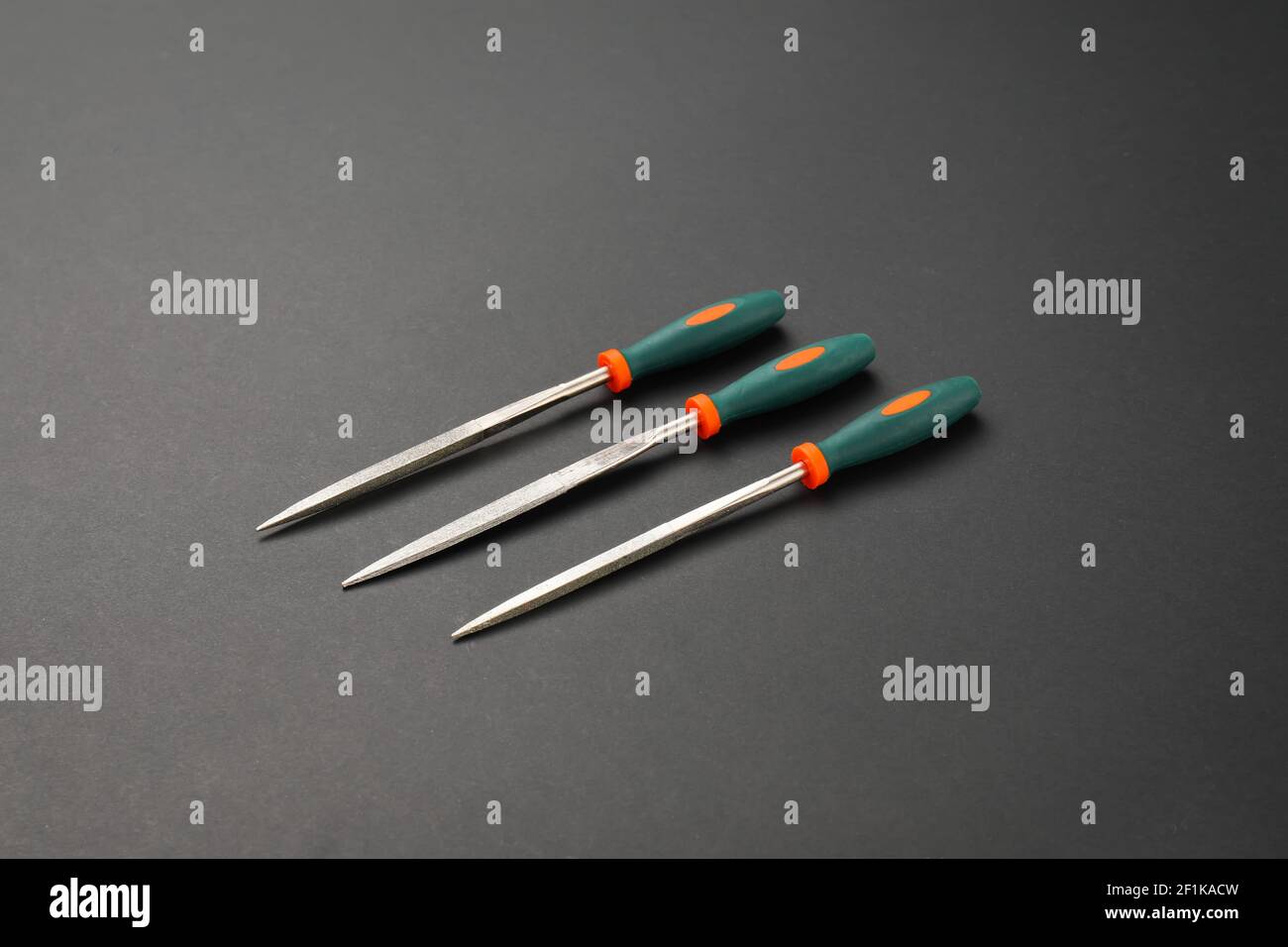Modern chisels on dark background Stock Photo - Alamy