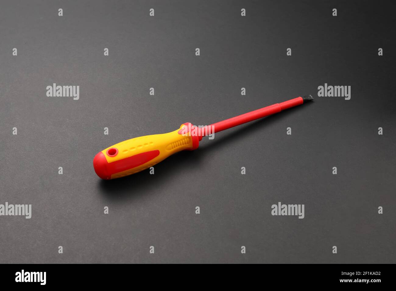 New screwdriver on dark background Stock Photo - Alamy