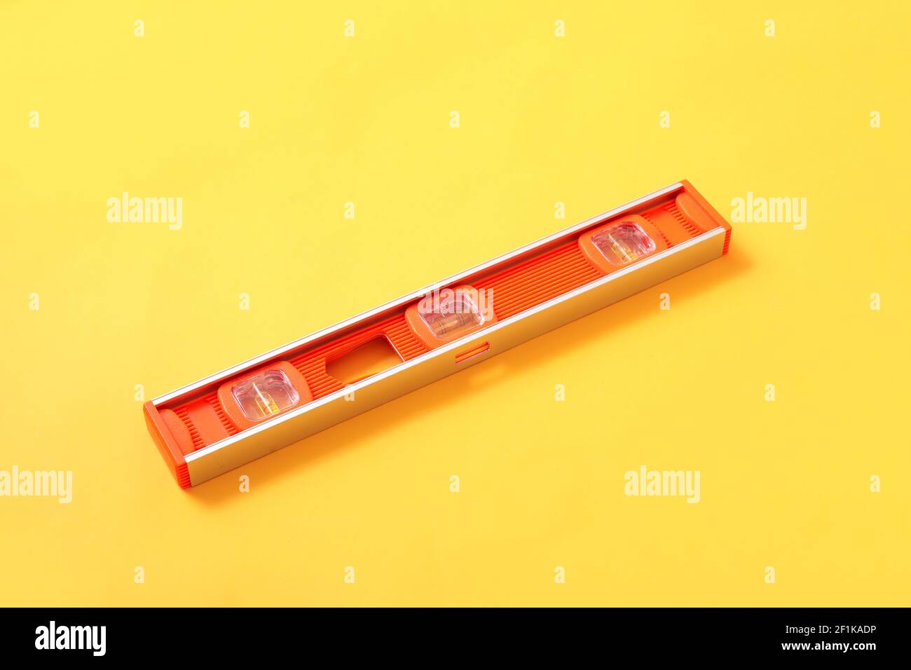 Spirit level on color background Stock Photo - Alamy