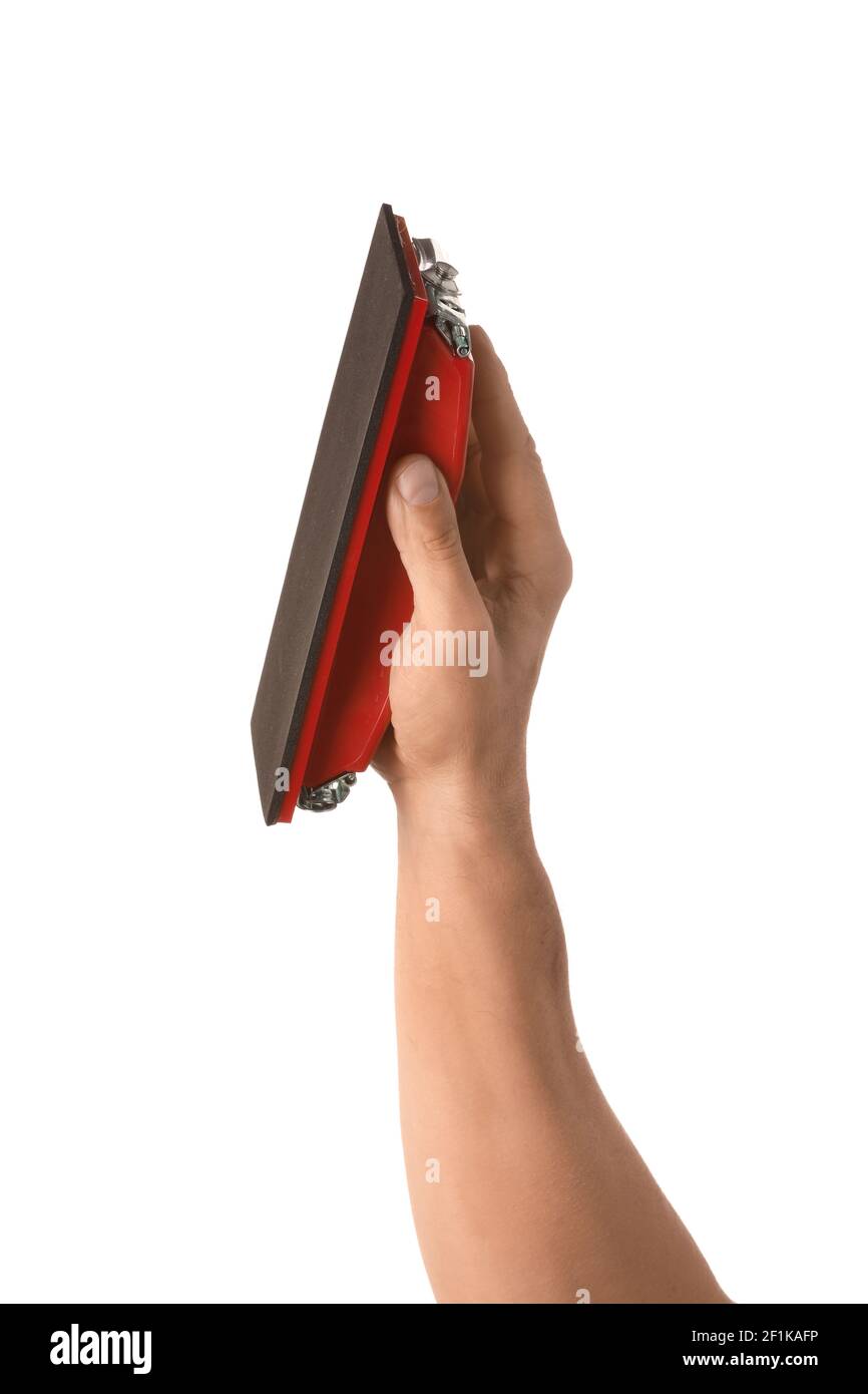Sanding float in male hand on white background Stock Photo - Alamy