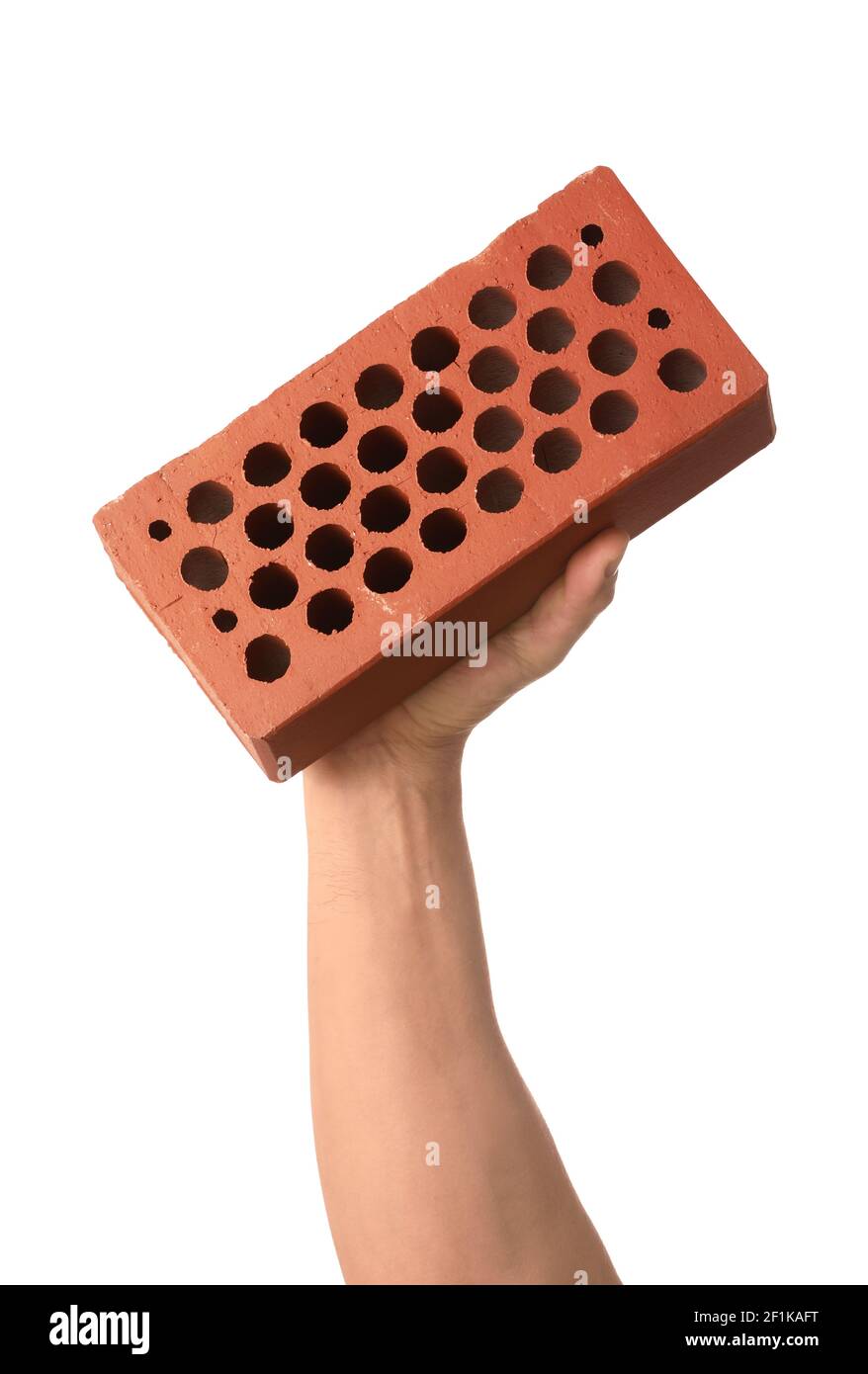 Brown brick in male hand on white background Stock Photo - Alamy