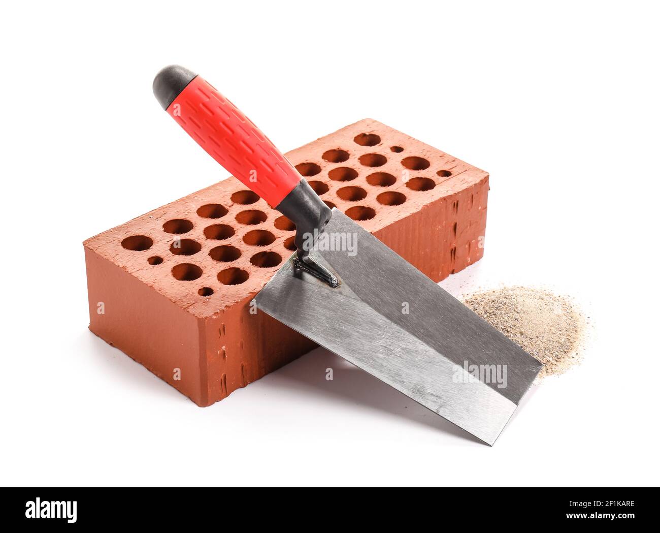 Spatula with brown brick on white background Stock Photo - Alamy