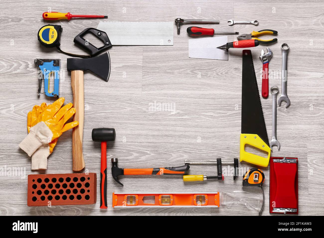 Frame made of construction tools on light wooden background Stock Photo ...