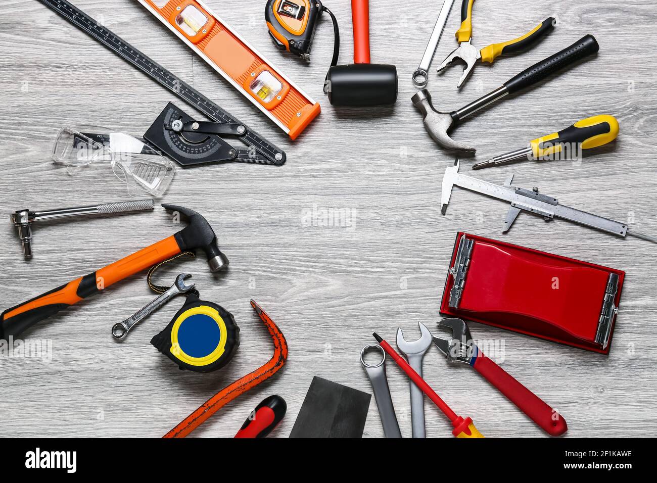 Frame made of construction tools on light wooden background Stock Photo ...